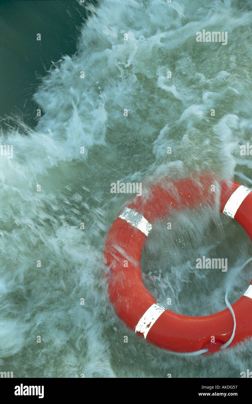 orange life saving rubber ring in a rough sea Stock Photo - Alamy