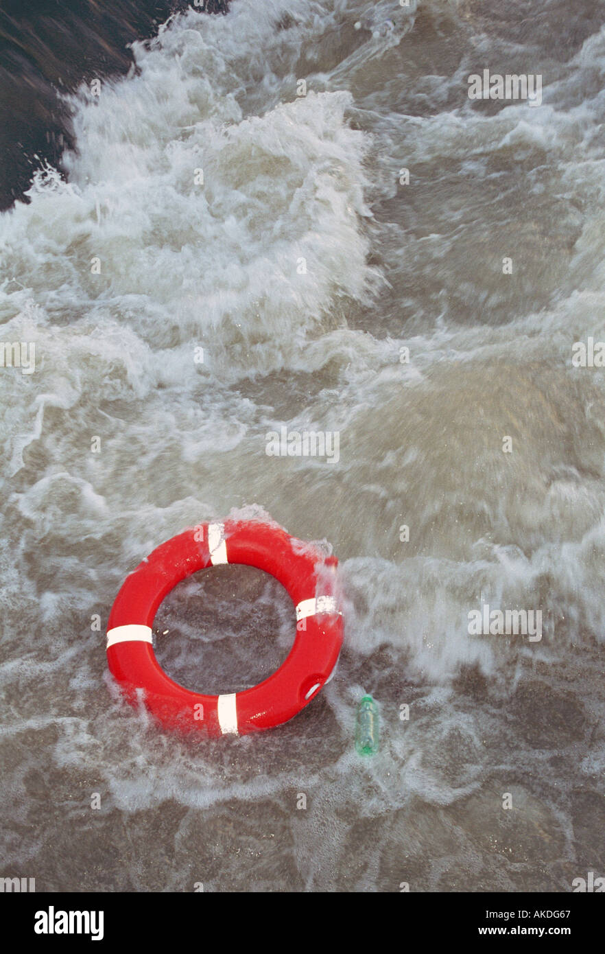 orange life saving rubber ring in a rough sea Stock Photo - Alamy