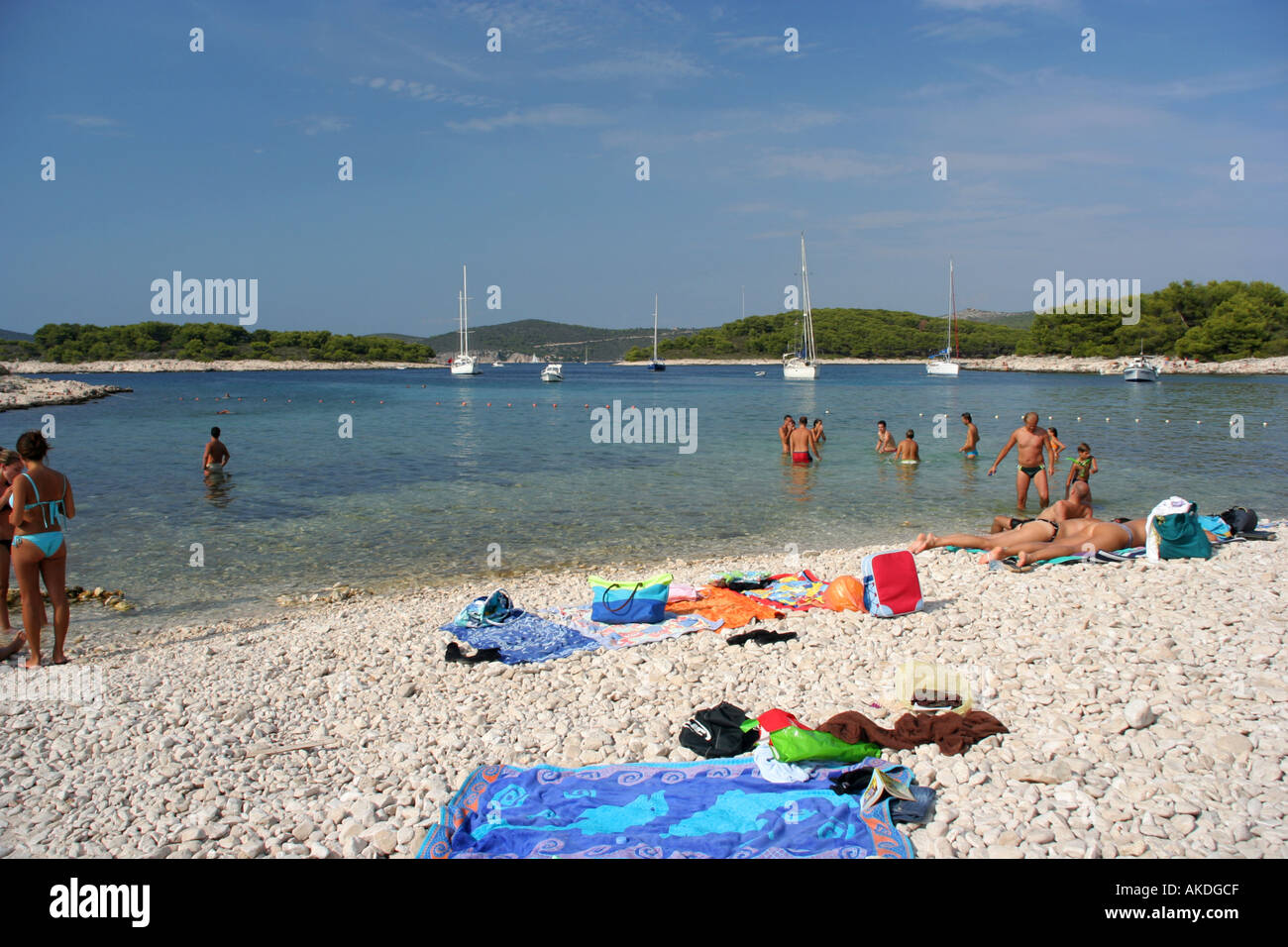 Tourist getting sun tan on Mlini beach of Pakleni Islands Stock Photo ...