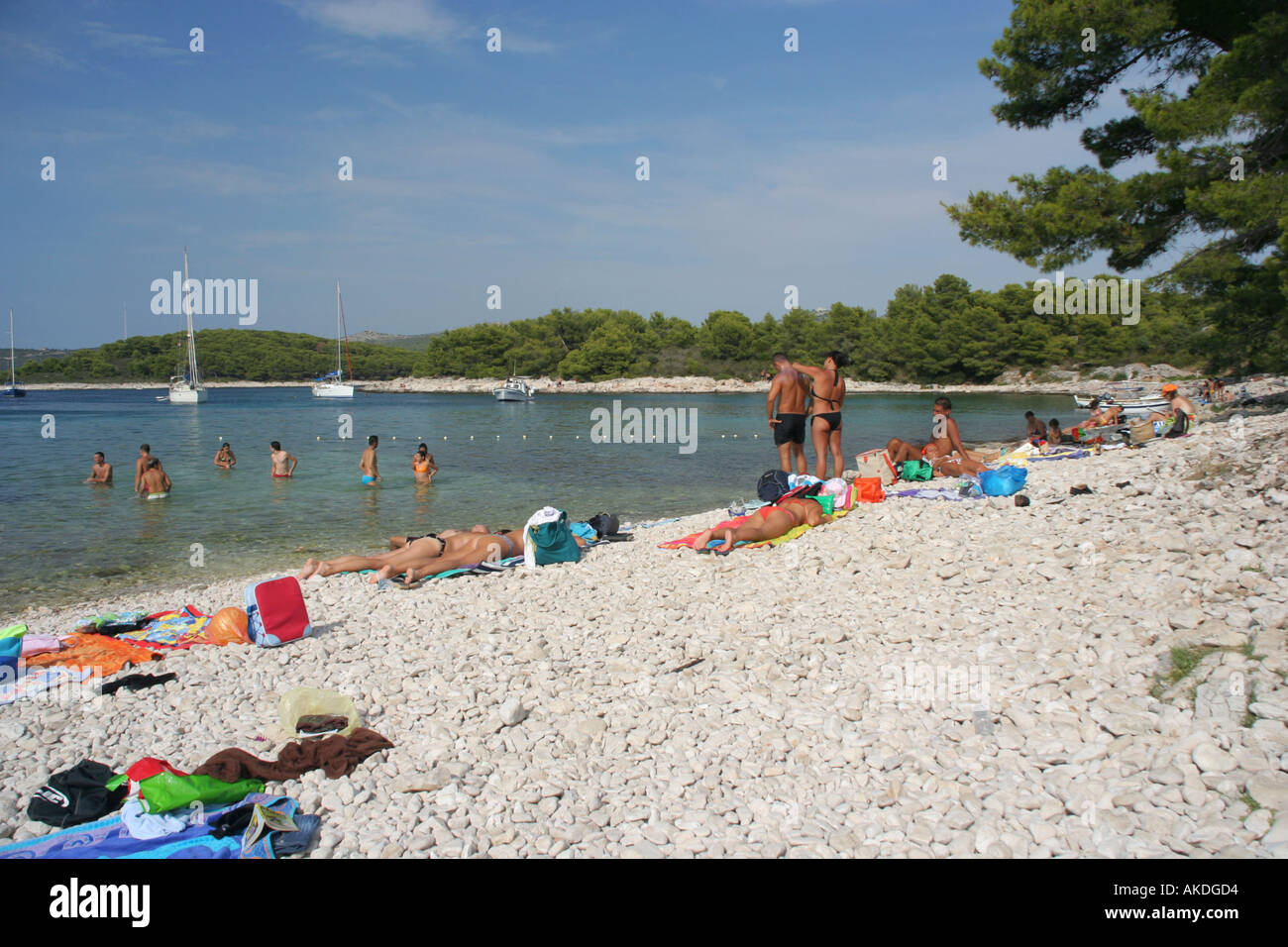Tourist getting sun tan on Mlini beach of Pakleni Islands Stock Photo ...