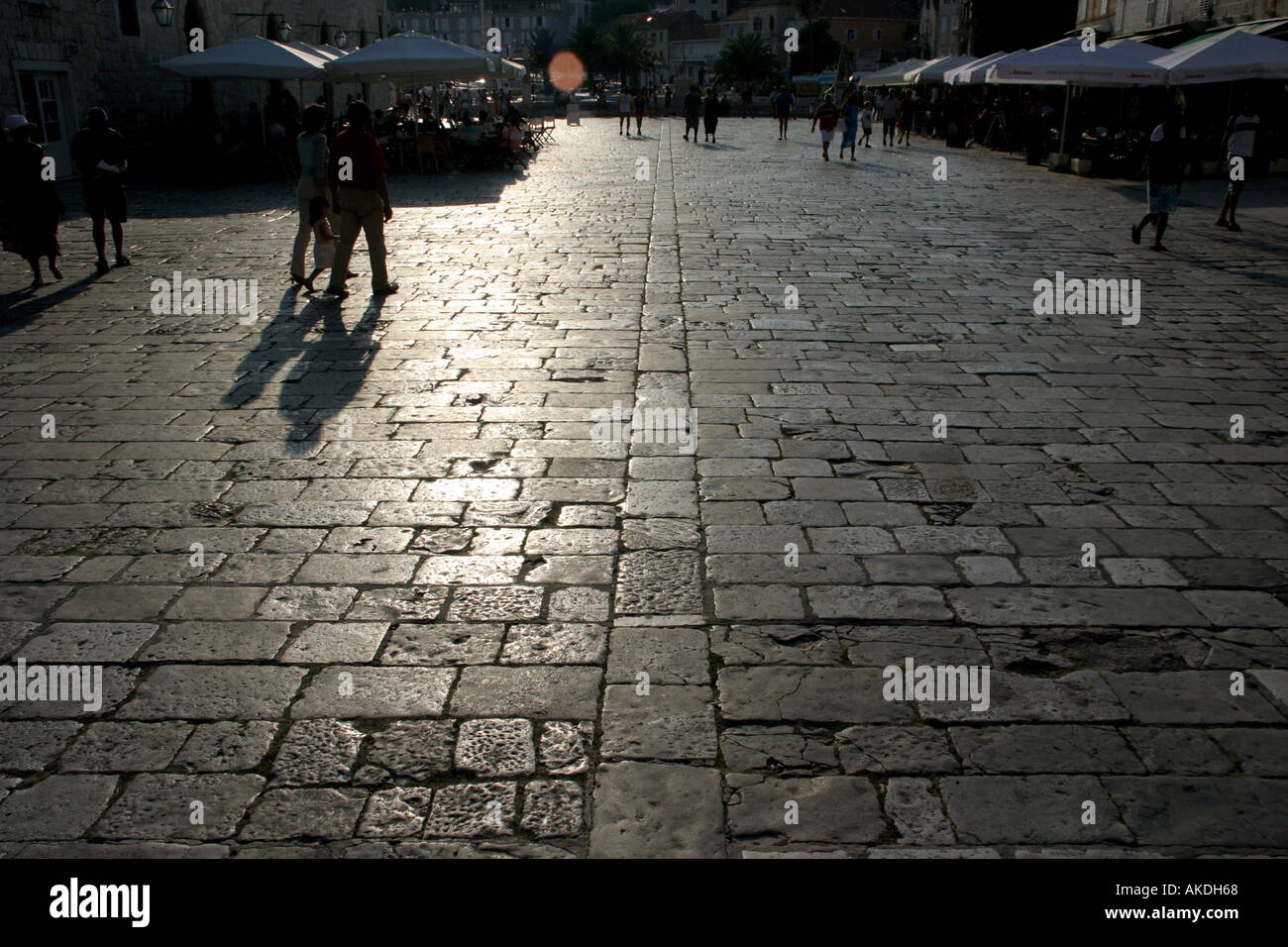 Sun reflexing in the stone pavement of Hvar town Stock Photo - Alamy