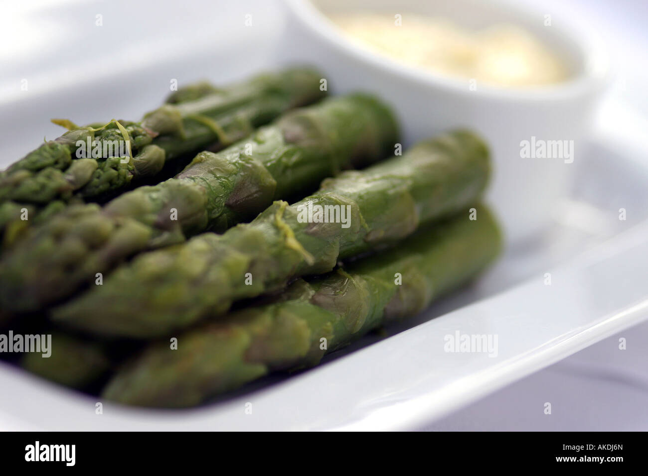 freshly cooked asparagus on a white plate Stock Photo - Alamy