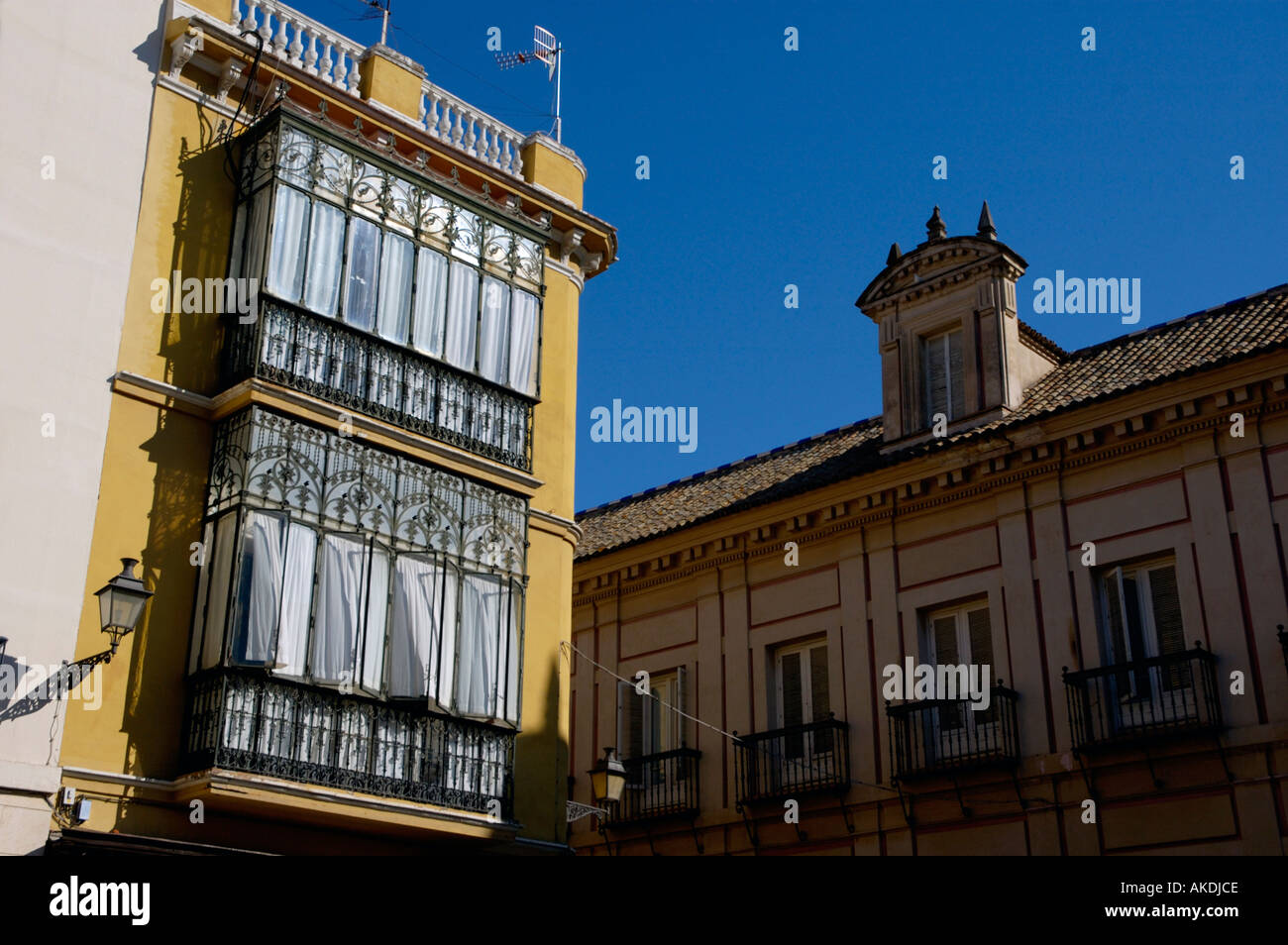 Traditional building with bow windows, Barrio Santa Cruz, Seville ...