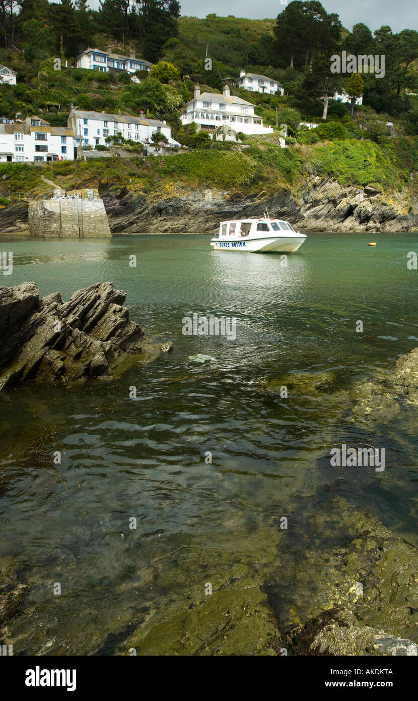 Small motorboat moored in the bay of Polperro, a large fishing village ...