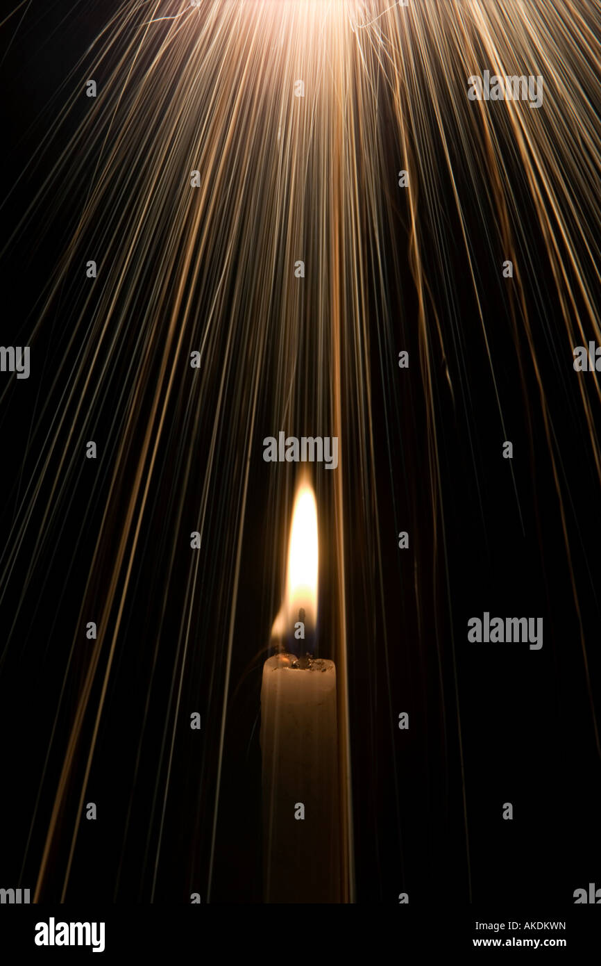 Candle light with light spark trails Stock Photo - Alamy