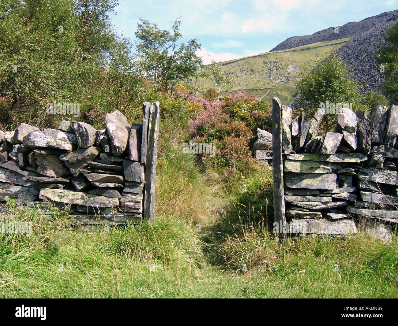 opening in stone wall, snowdonia, wales Stock Photo - Alamy