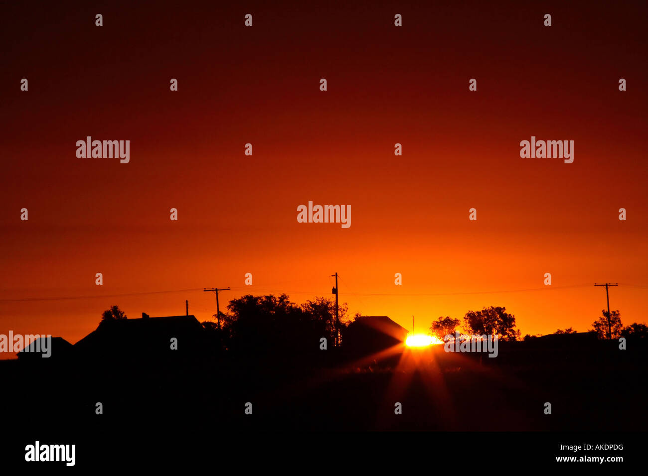 Sun rising behind a Saskatchewan farmyard Stock Photo - Alamy