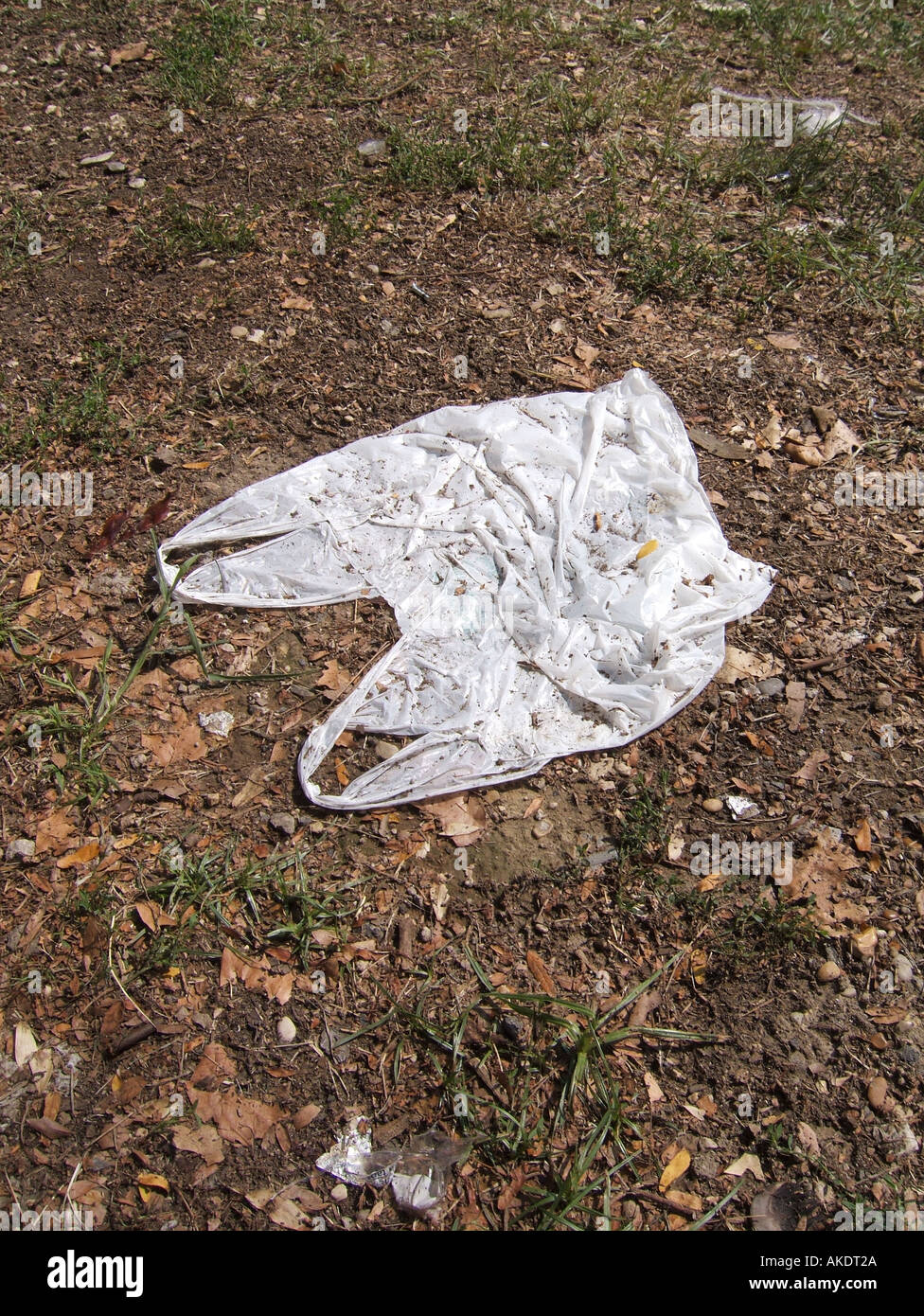 white plastic shopping bag on wet floor Stock Photo - Alamy