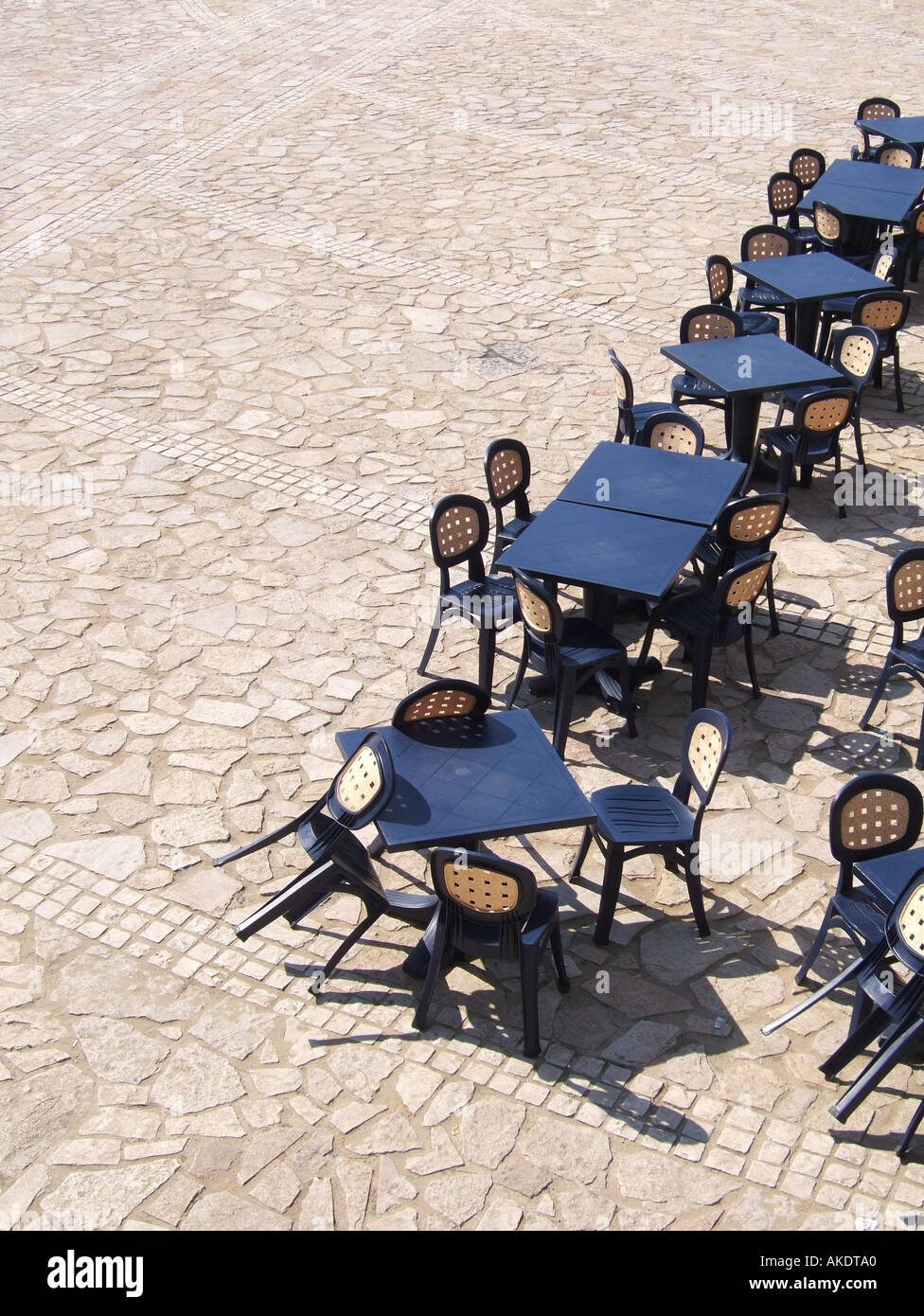 empty black chairs and tables outdoors Stock Photo - Alamy