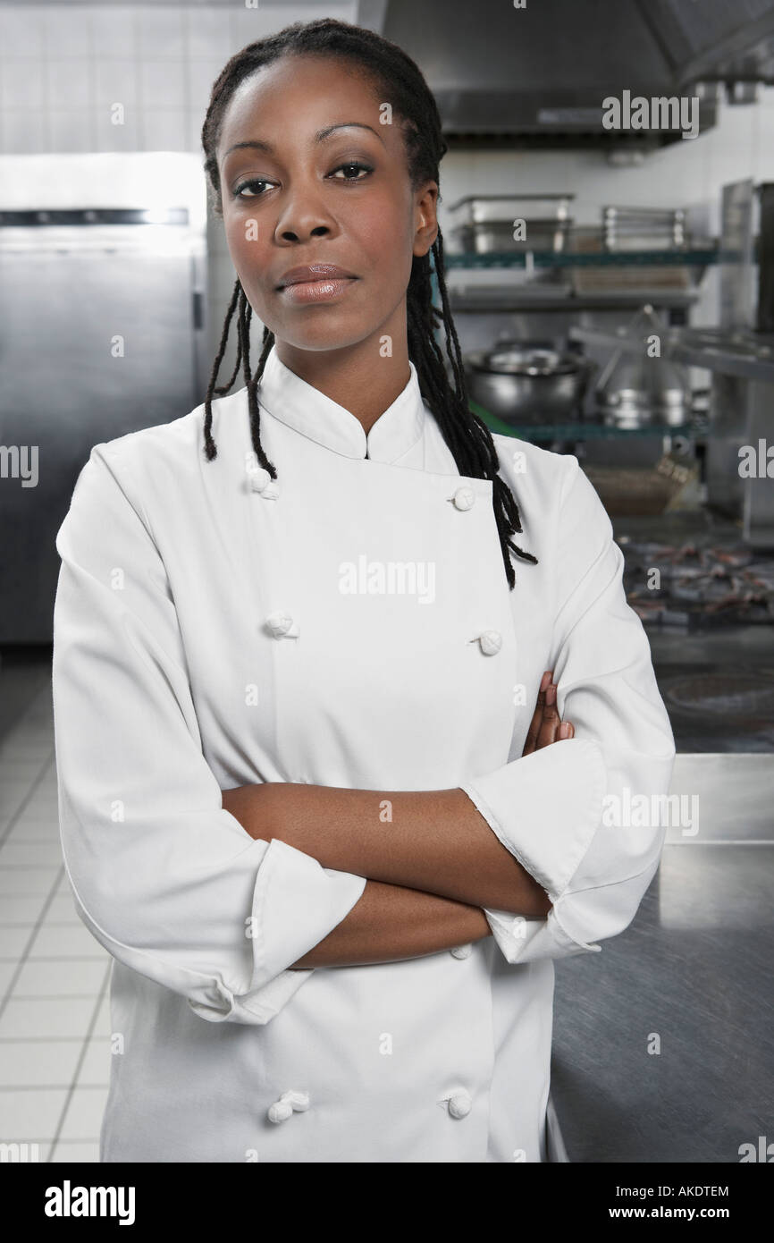 Female chef with arms crossed in kitchen, portrait Stock Photo - Alamy