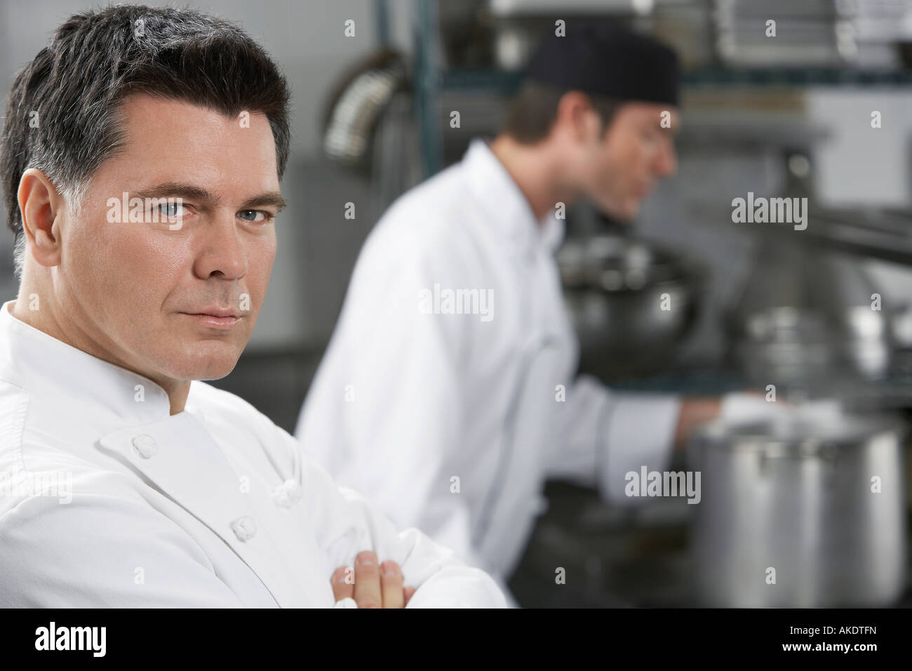 Male chef with colleague in kitchen, portrait Stock Photo - Alamy