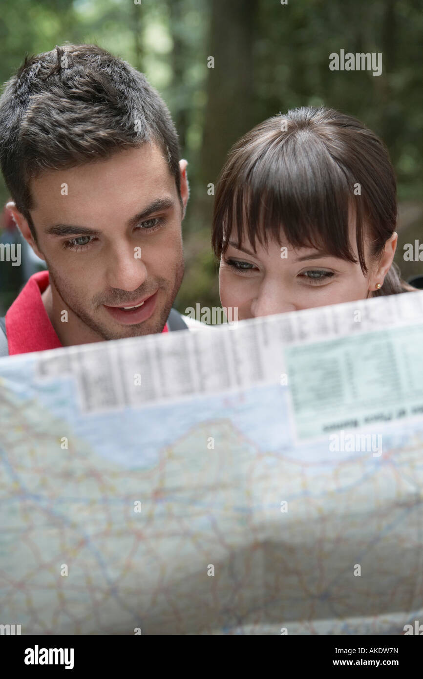 Couple observing map, outdoors, close-up Stock Photo - Alamy