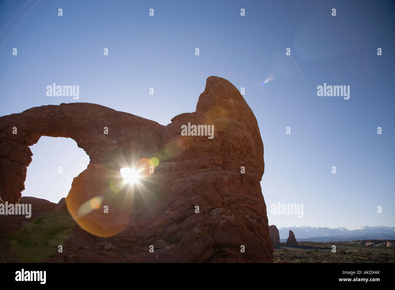 Sun shining through rock formation hi-res stock photography and images ...