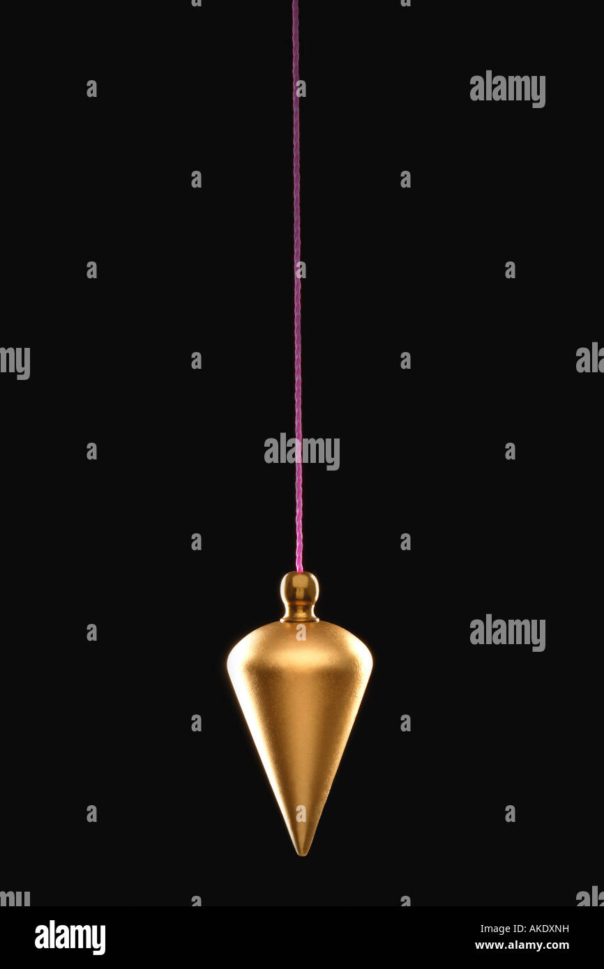 Pendulum on string, black background Stock Photo - Alamy