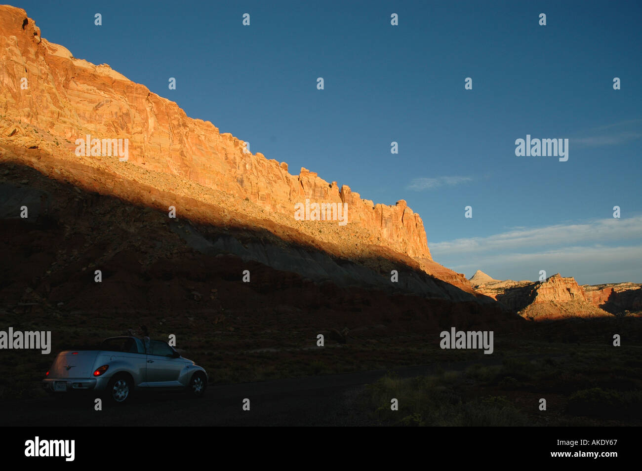 Utah Capitol Reef National Park white rock dome cliff rim car in fading ...