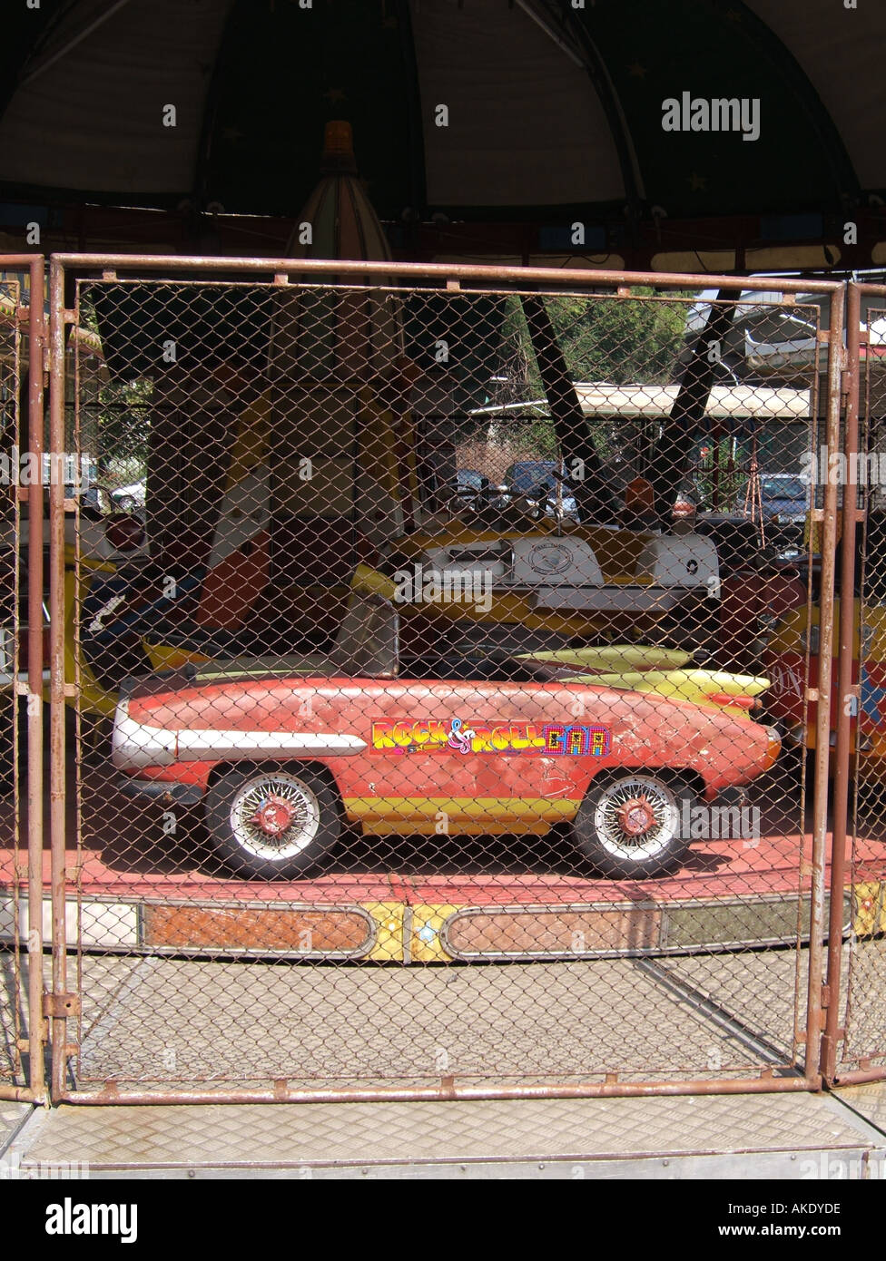 red car on run down fair ground ride Stock Photo - Alamy