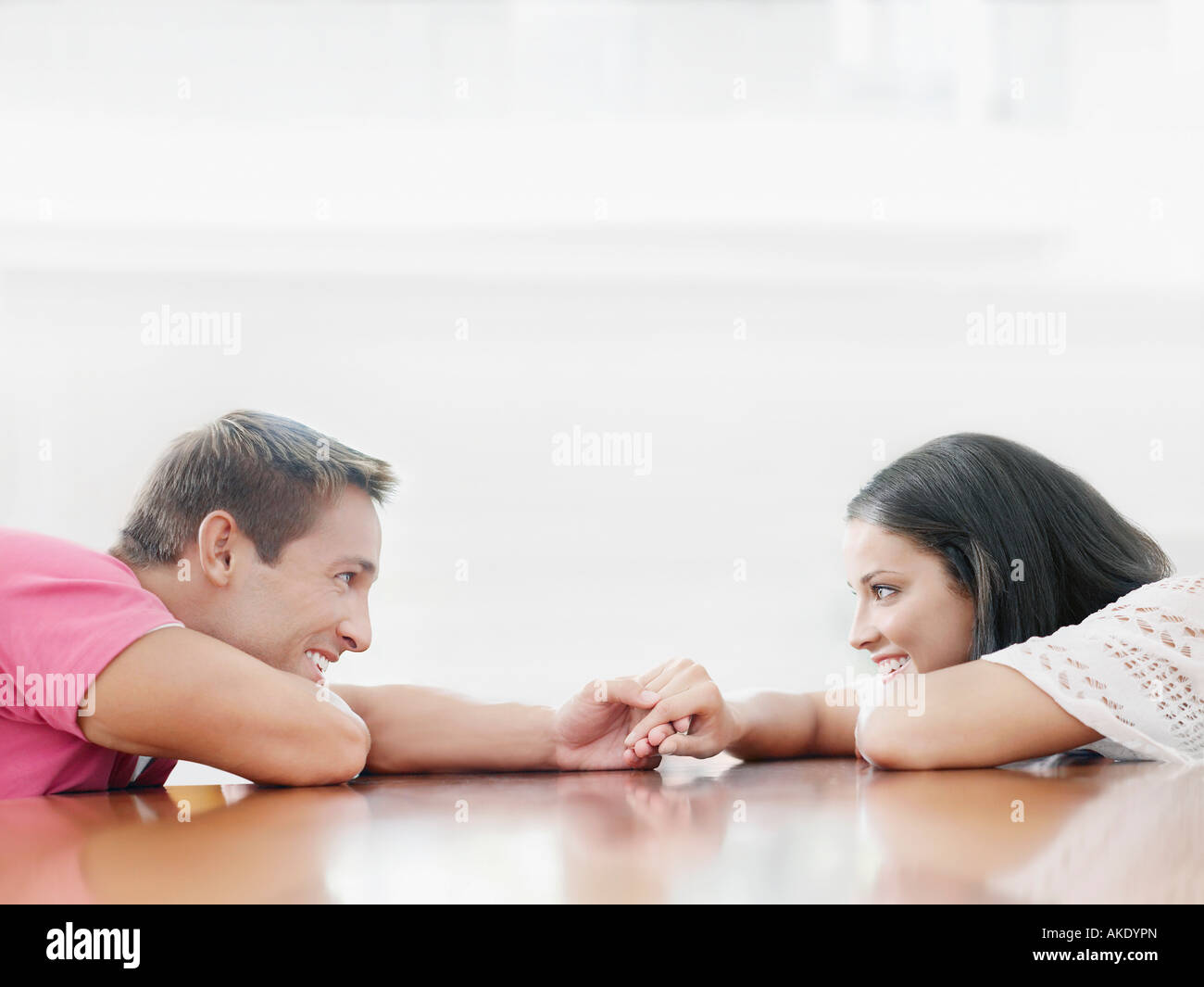 Holding hands across table hi-res stock photography and images - Alamy