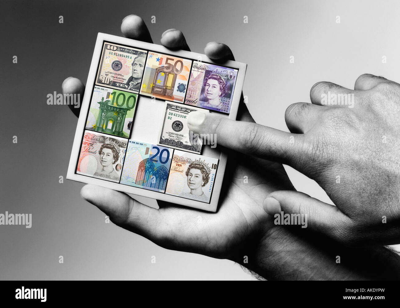 Man solving economic puzzle Stock Photo - Alamy