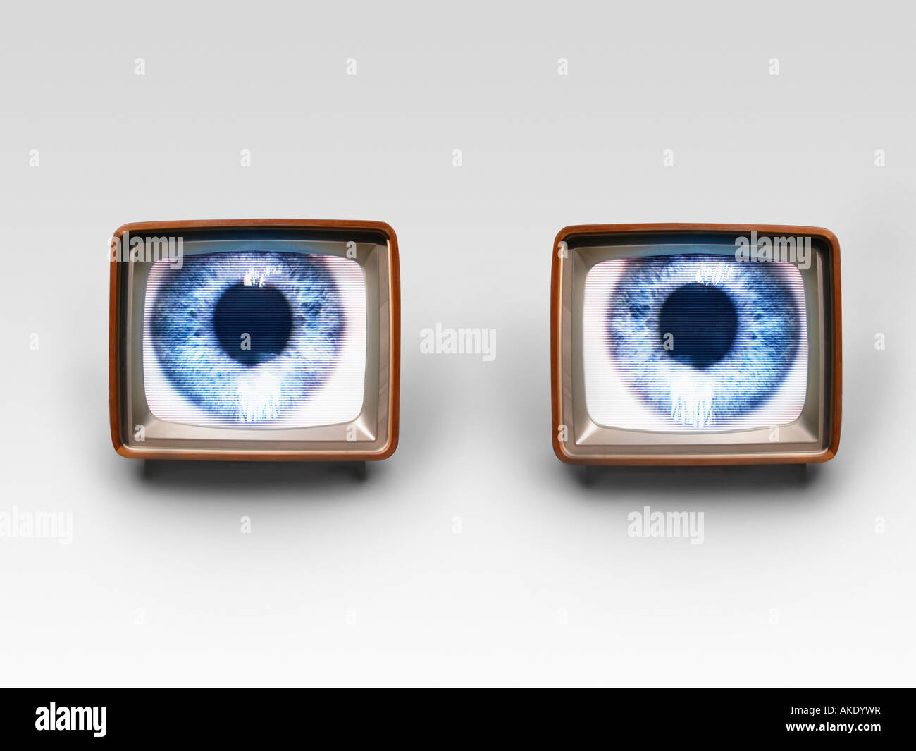 Two television sets with eyes on screens, digital composite Stock Photo ...