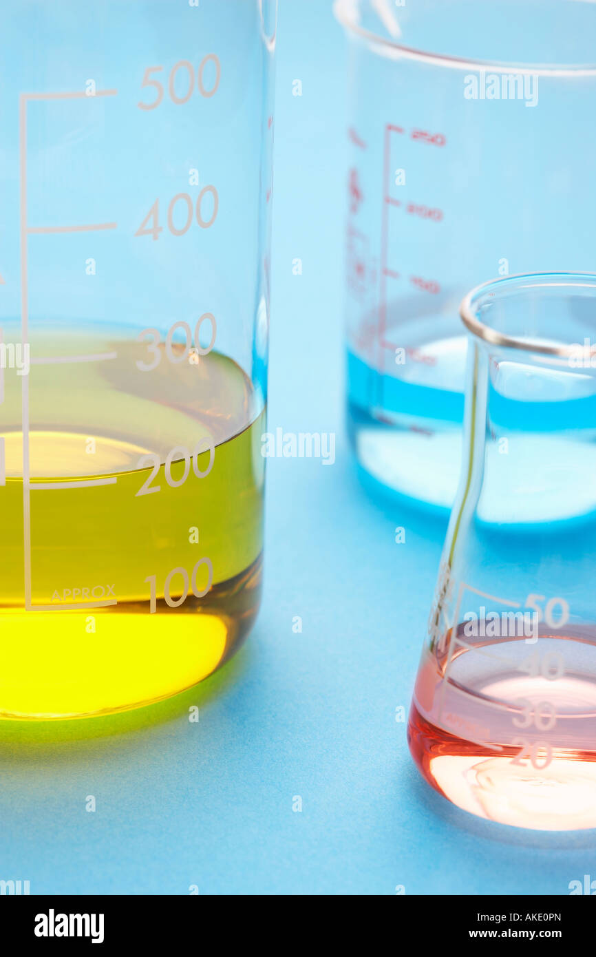 Coloured liquids in beakers, close-up Stock Photo - Alamy