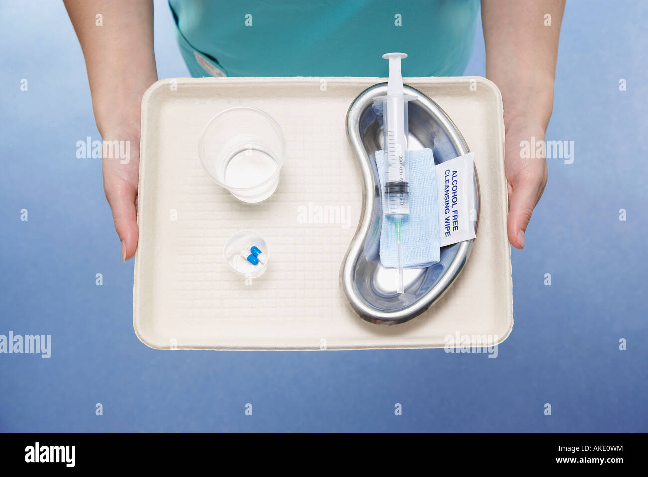 Medical surgeon holding tray with syringe and medication Stock Photo ...