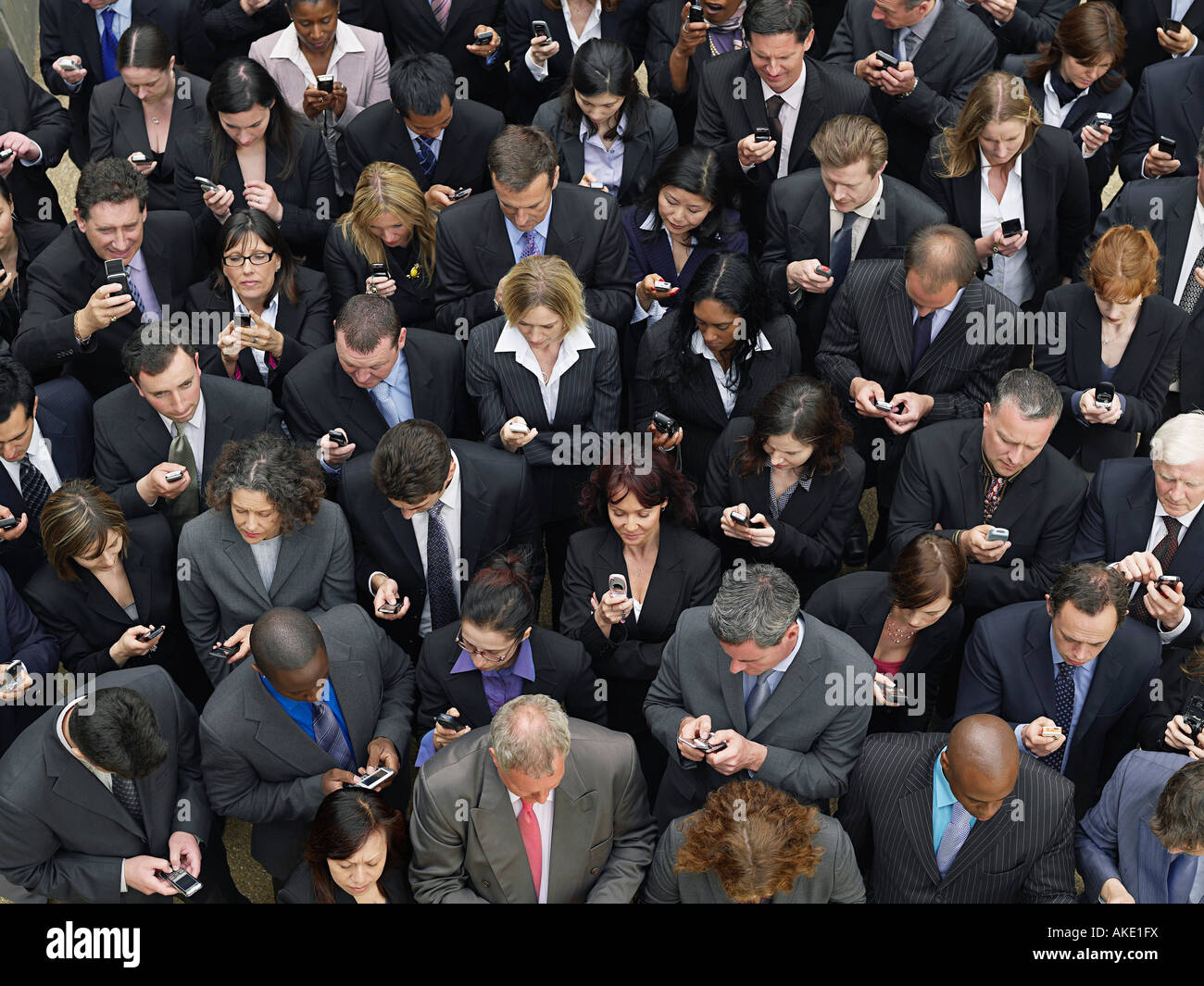 Large group of business people text messaging, elevated view Stock ...