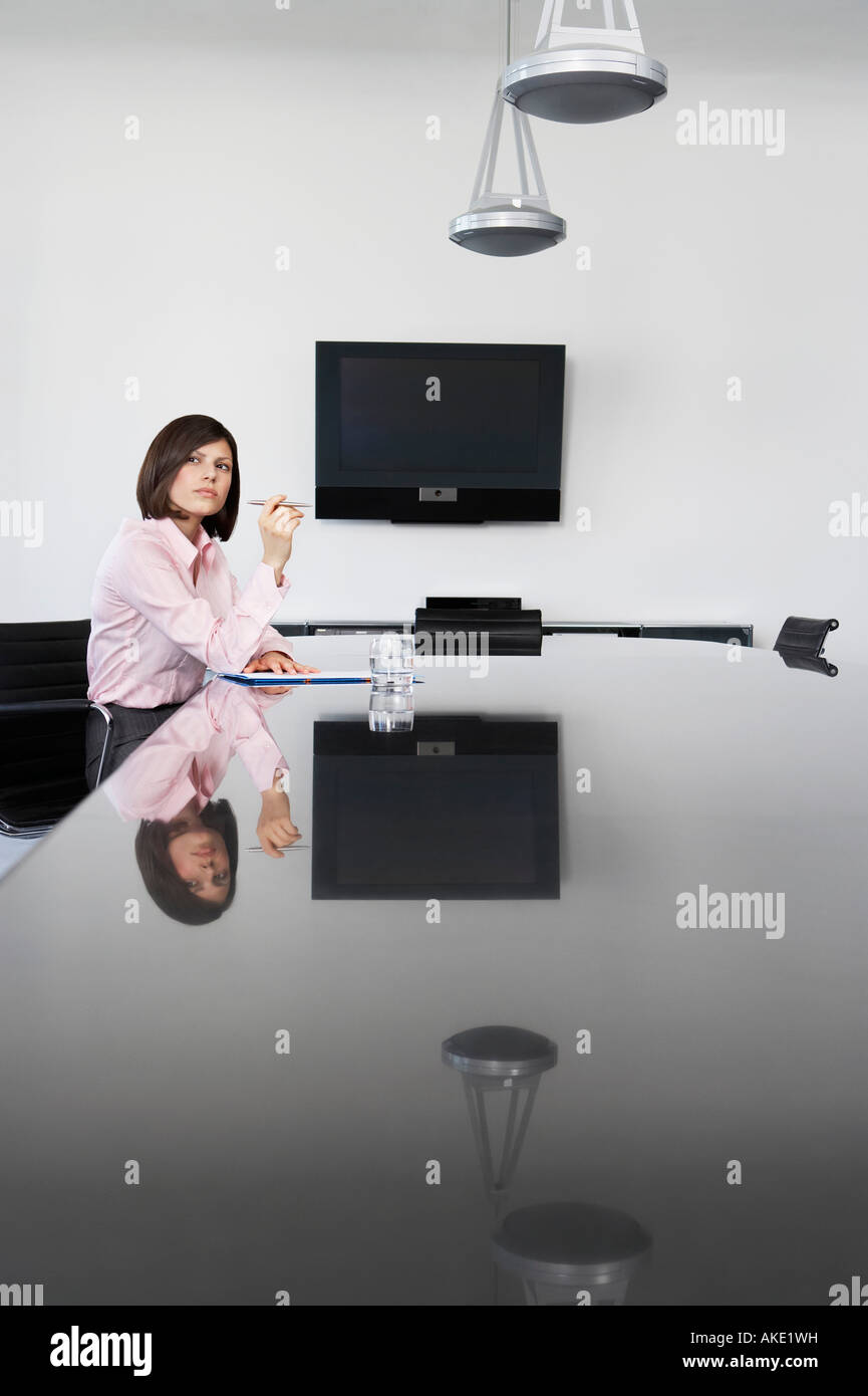 Business woman working at table in conference room Stock Photo - Alamy