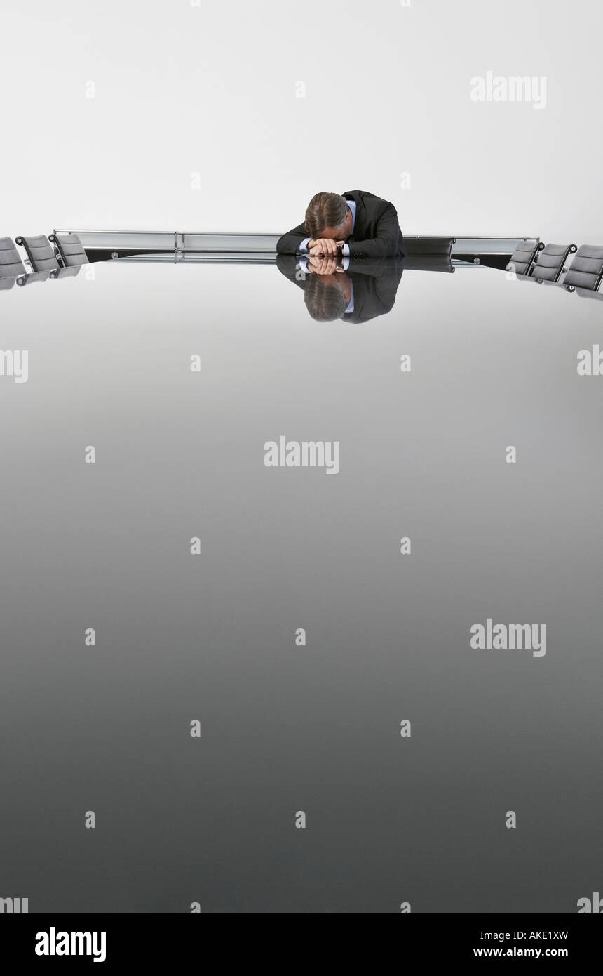 Business man resting at table in conference room Stock Photo - Alamy