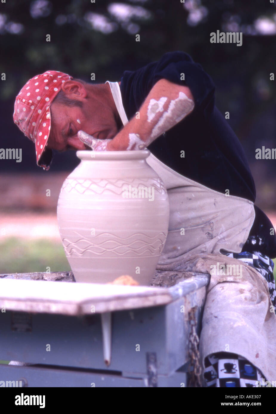 Making pots on traditional wheel hi-res stock photography and images ...
