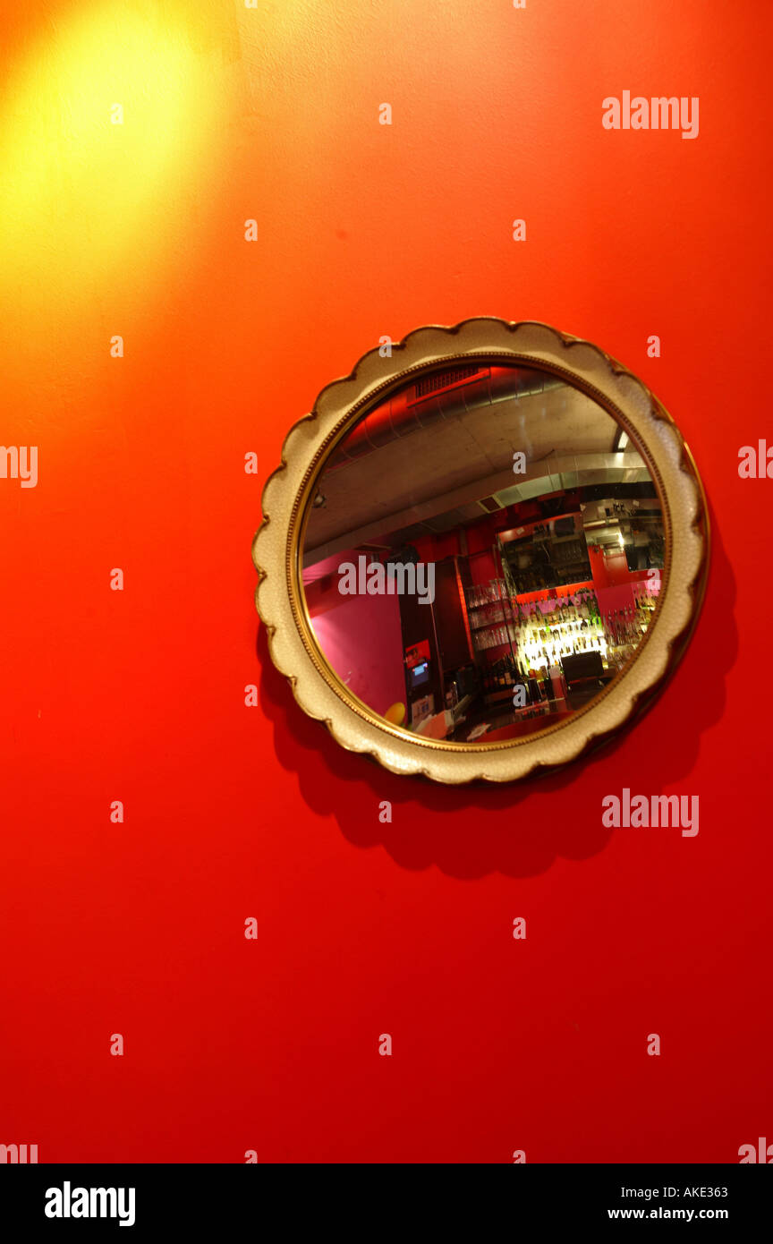 Mirror with a bar reflecting in it Red bar London Stock Photo - Alamy