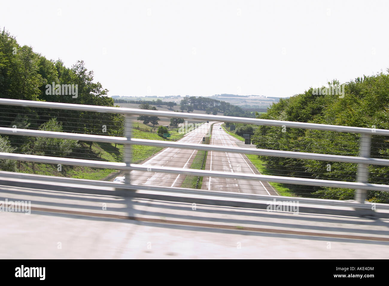 Shot taking driving over motorway bridge Stock Photo - Alamy