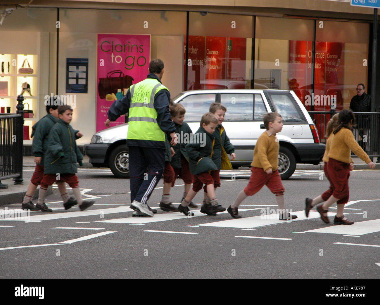 children crossing a Zebra crossing on the Kings Road in London Stock ...