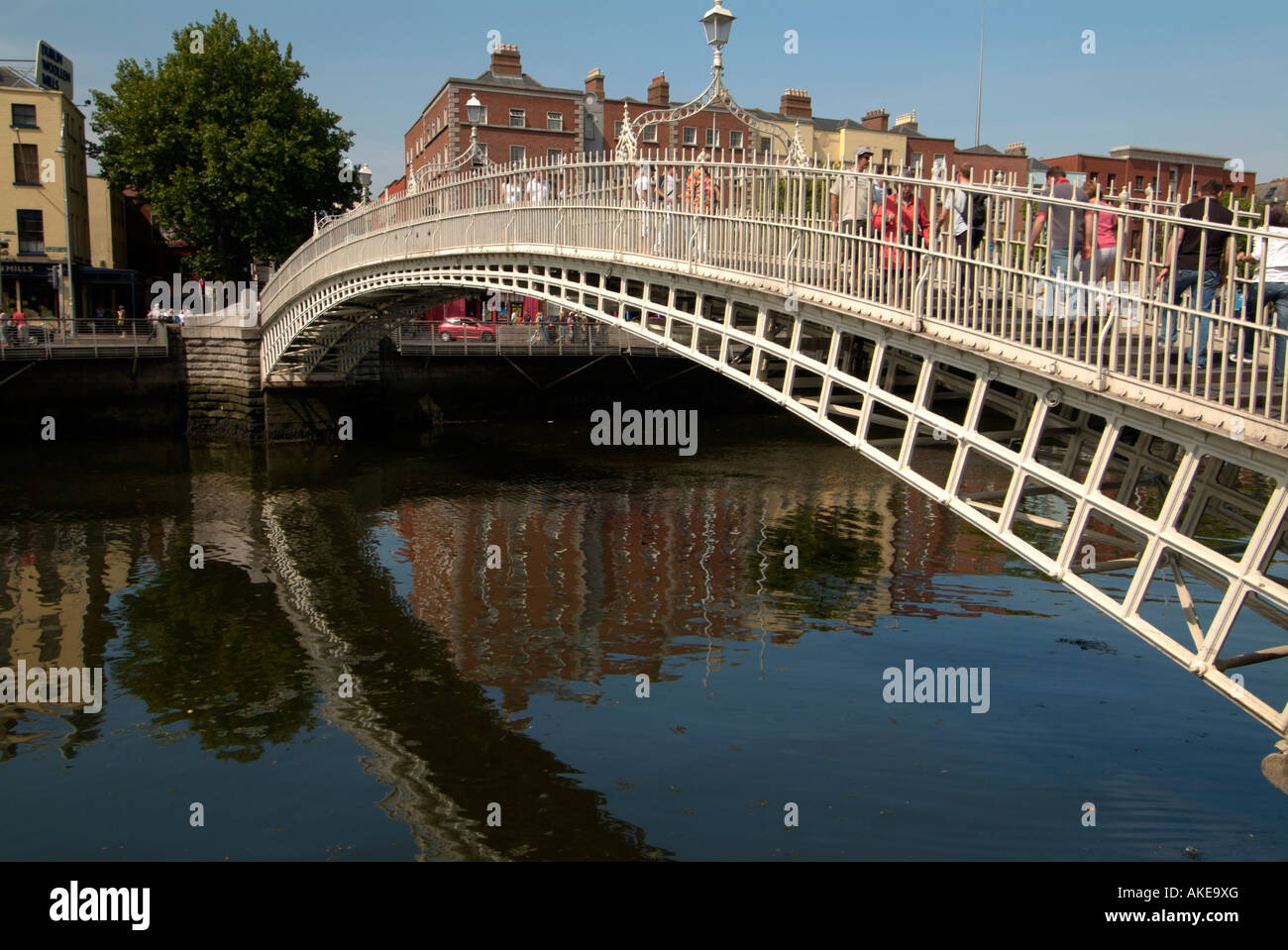 The ha'penny hapenny or halfpenny pedestrian bridge and its reflection ...