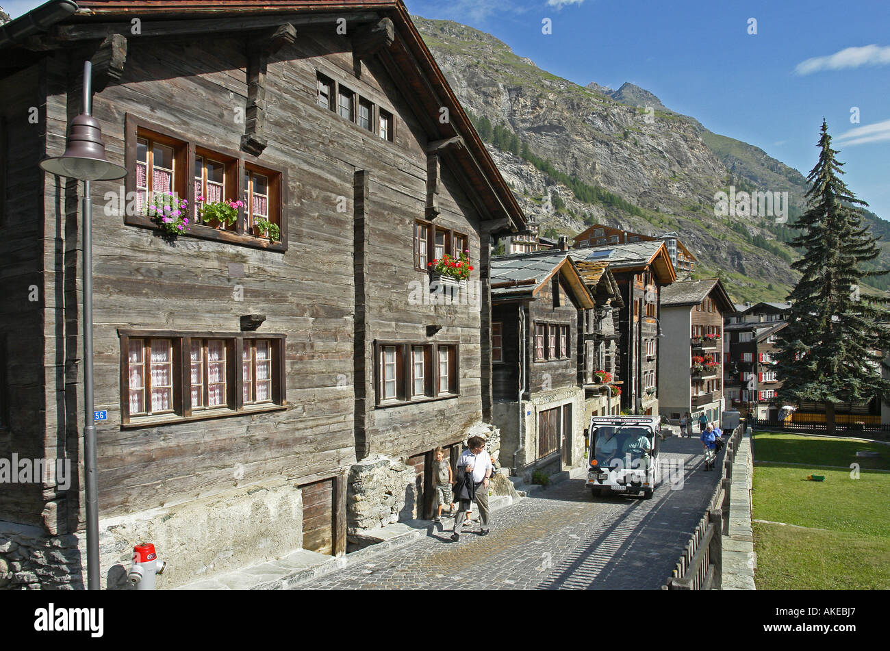Traditional Swiss houses in Zermatt along the road leading towards Furi ...