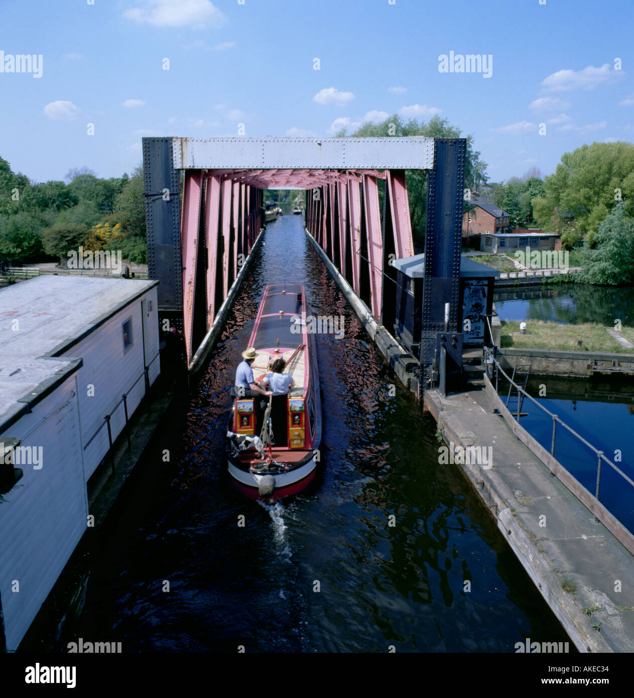Canal narrow boat crossing the Barton Swing Aqueduct, Trafford Park ...