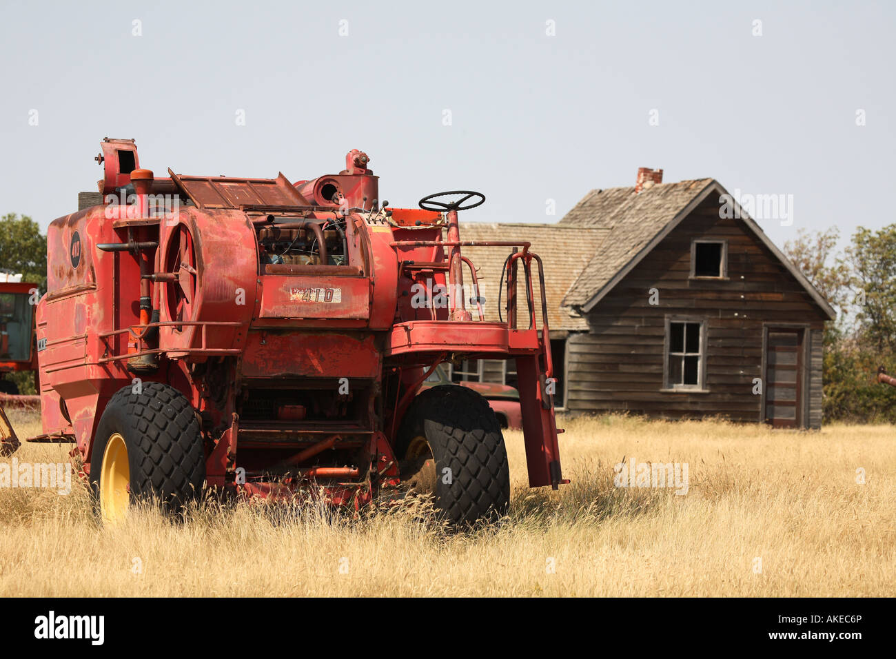 Abandoned combine and farm house in scenic Saskatchewan Stock Photo - Alamy