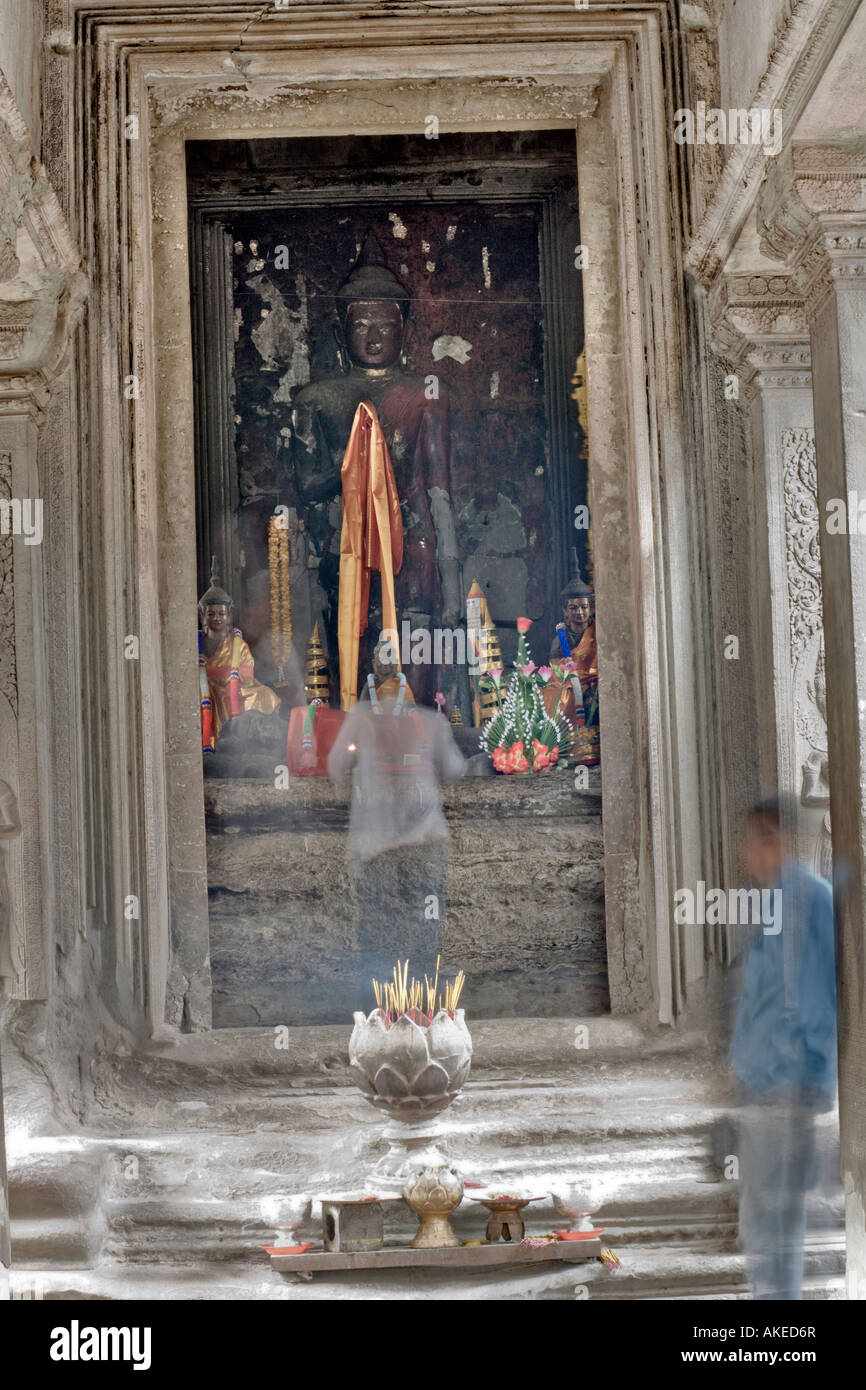 Ghost figures in front of Buddha, Angkor Wat, Angkor, Cambodia (blurred ...