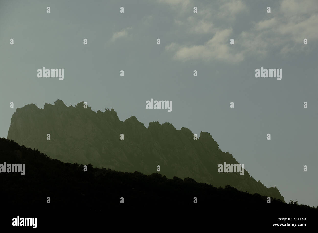 sharp sawtooth mountain ridge in muted colour Stock Photo - Alamy