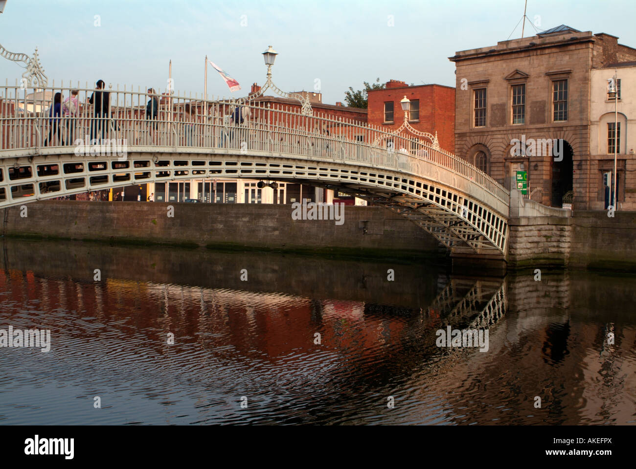 The ha'penny hapenny or halfpenny pedestrian bridge and its reflection ...