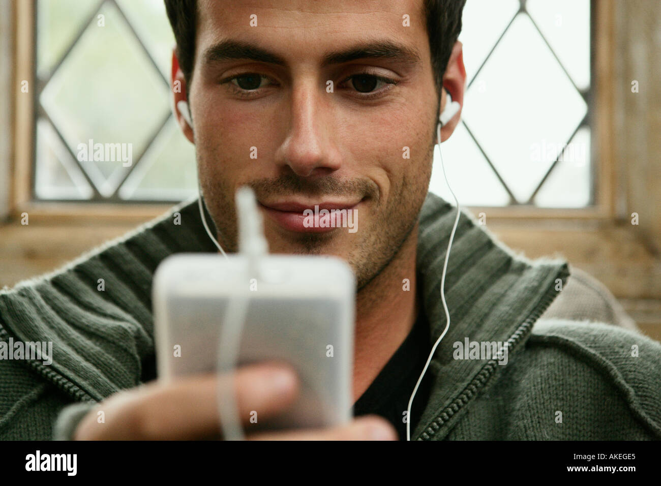Man using mp3 player Stock Photo - Alamy