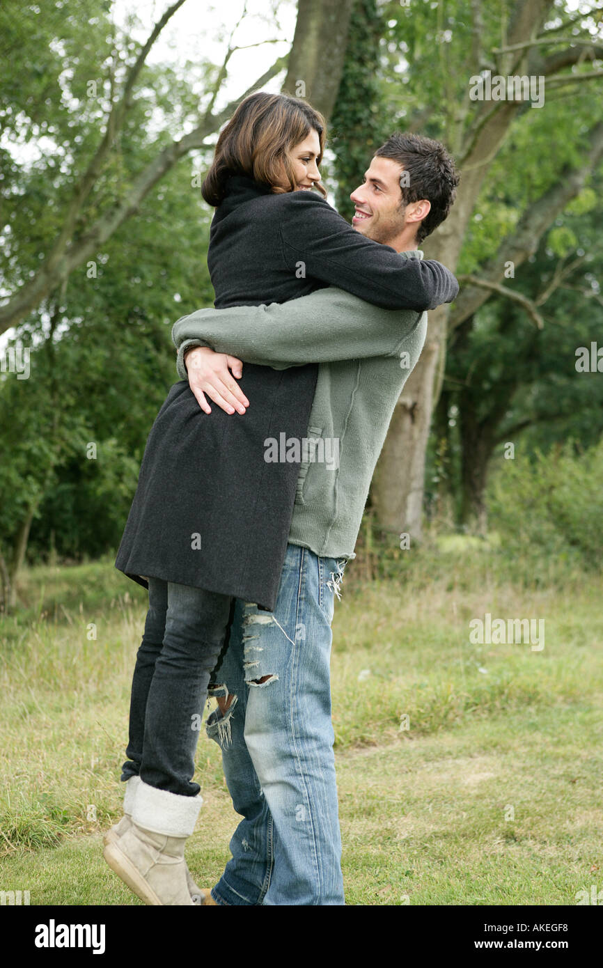 Man hugging woman lifting her off the ground Stock Photo: 4888823 - Alamy