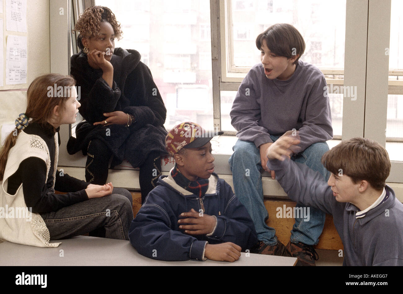 group of teenagers together at school between classes Stock Photo - Alamy