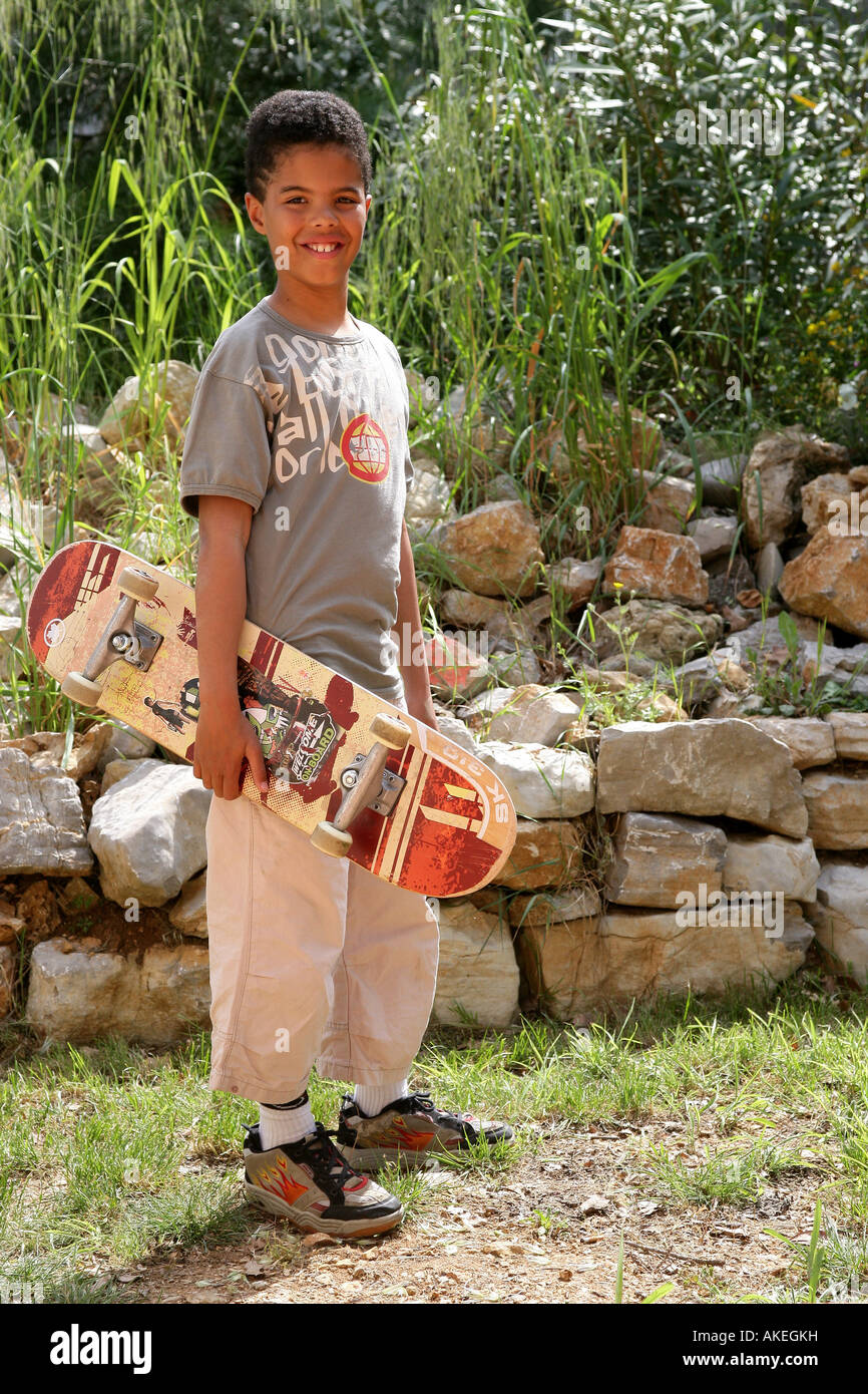 metis child with skate-board Stock Photo - Alamy