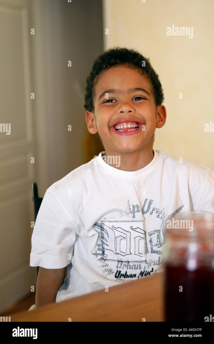 metis boy having a snack at home Stock Photo - Alamy