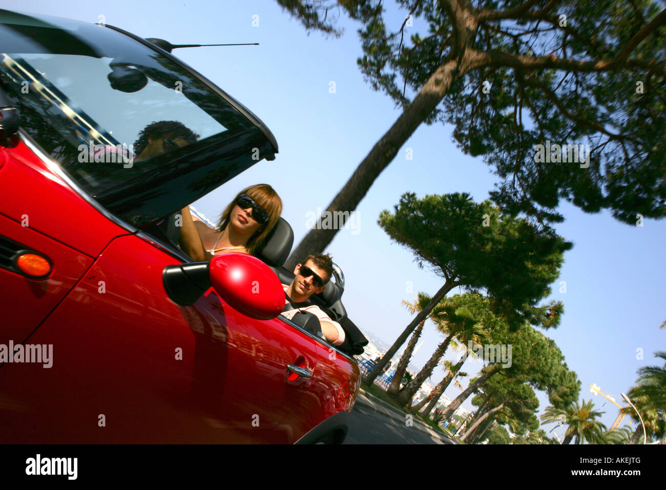 friends in a red car Stock Photo - Alamy