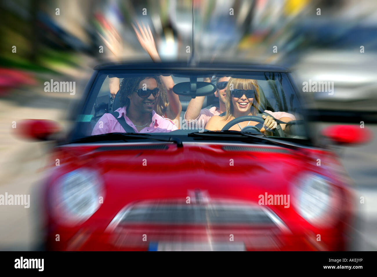 friends in a red convertible car Stock Photo - Alamy