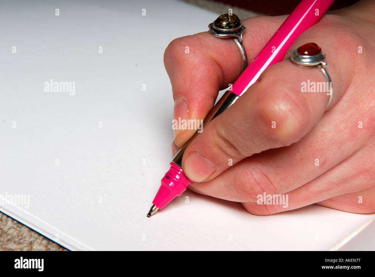 Hand writing with pen and paper Stock Photo - Alamy