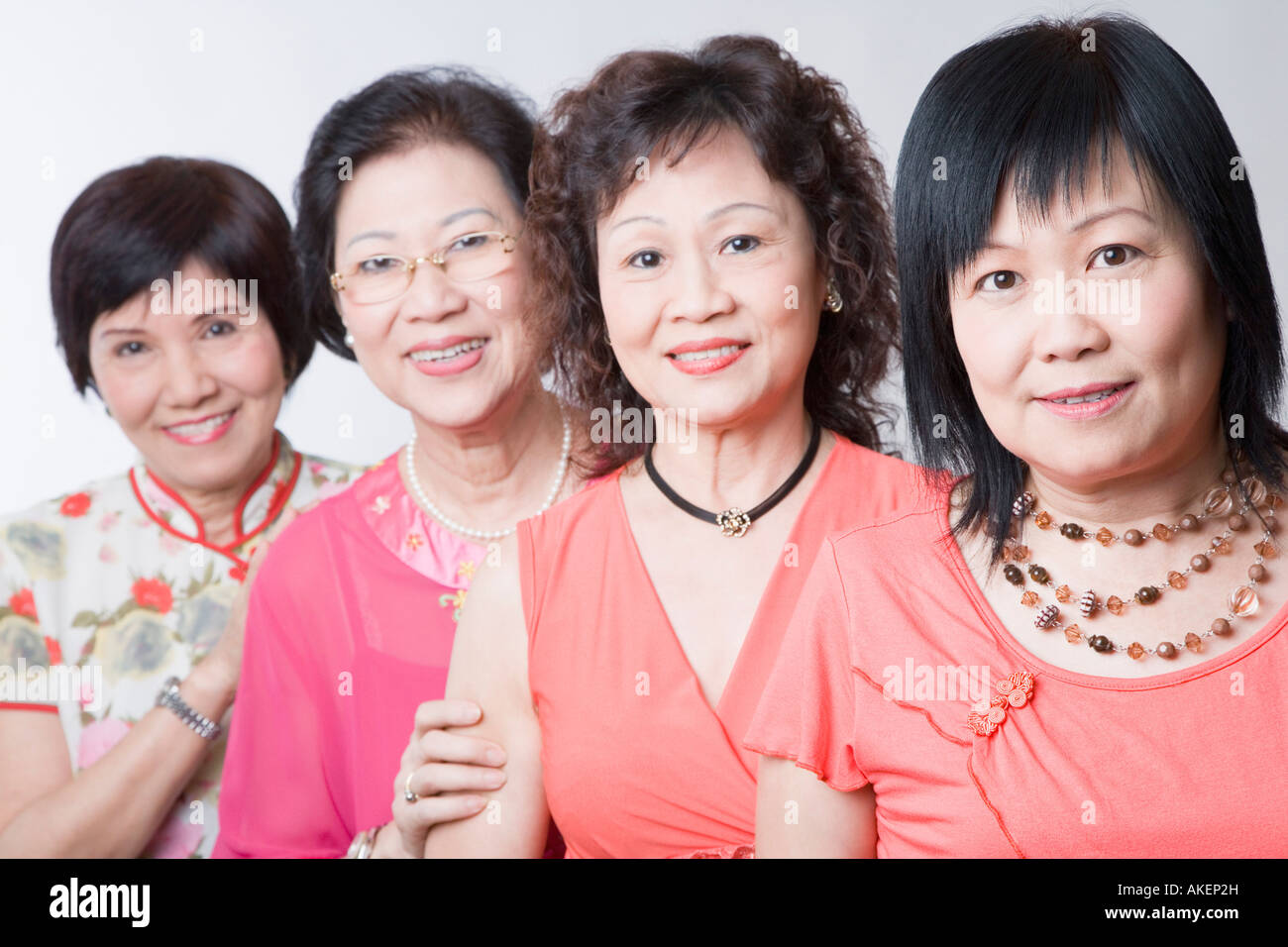 Portrait of three senior women and a mature woman smiling Stock Photo ...