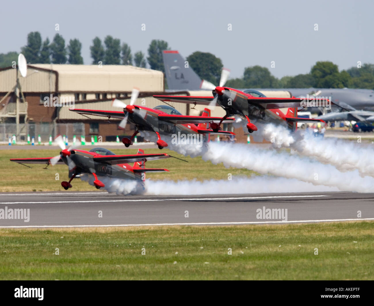 Airforce aerial display team with white smoke contrails Stock Photo - Alamy