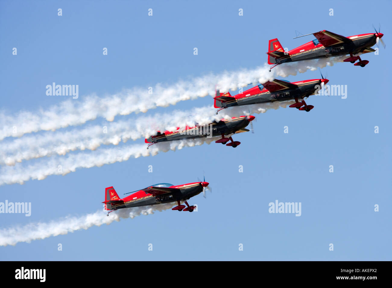 Airforce aerial display team with white smoke contrails Stock Photo - Alamy